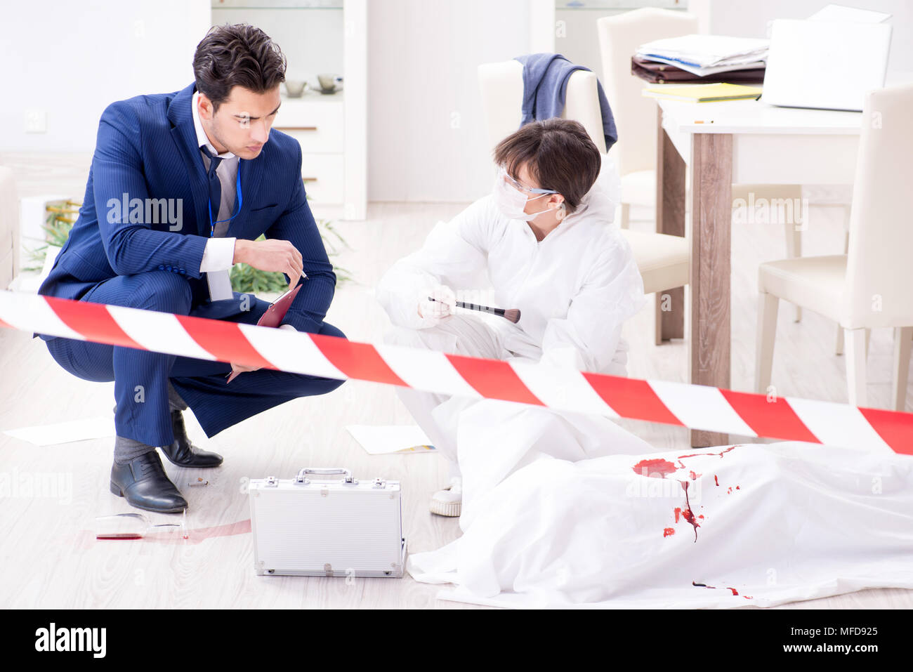 Forensics investigator at the scene of office crime Stock Photo - Alamy