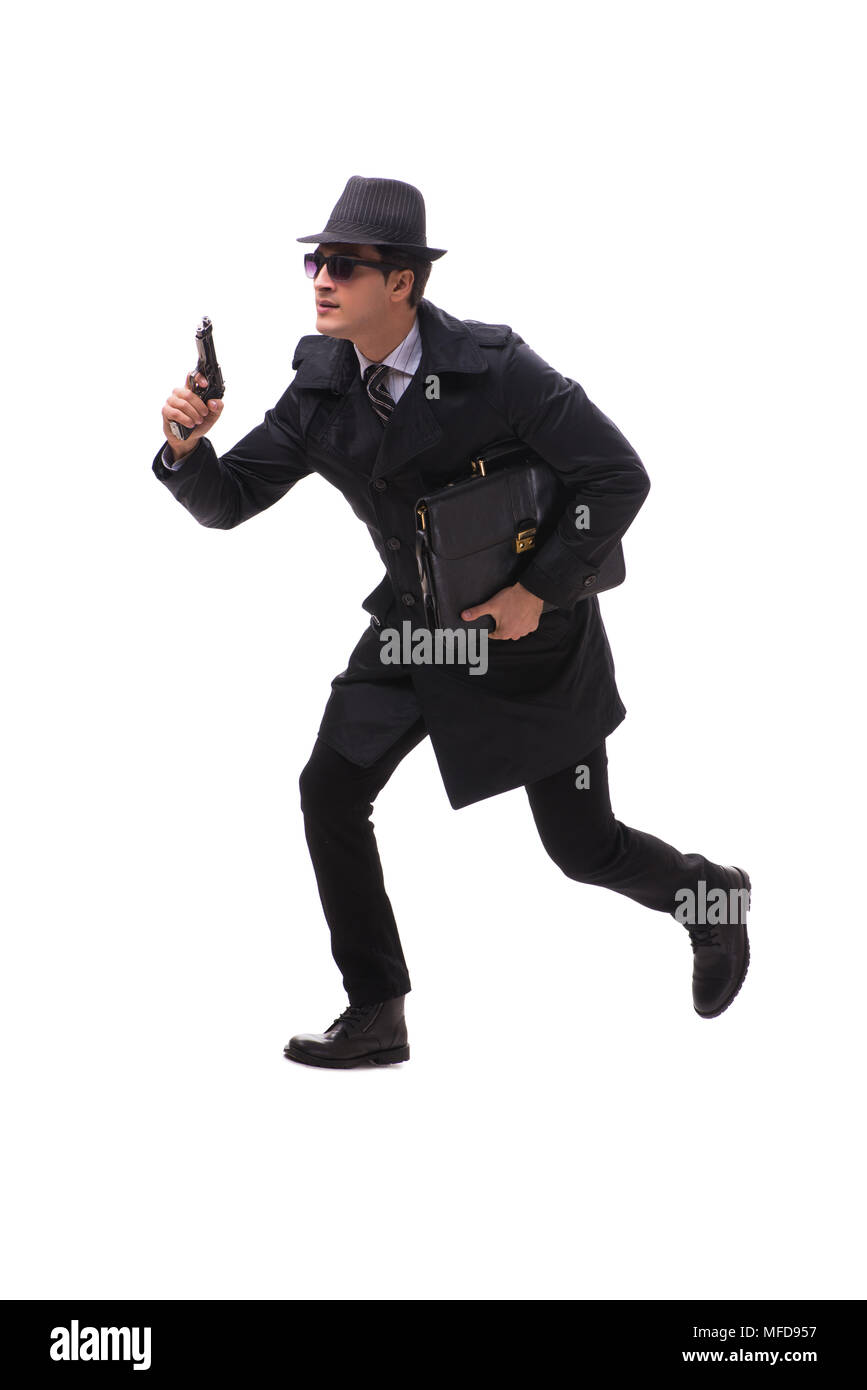 Man spy with handgun isolated on white background Stock Photo - Alamy