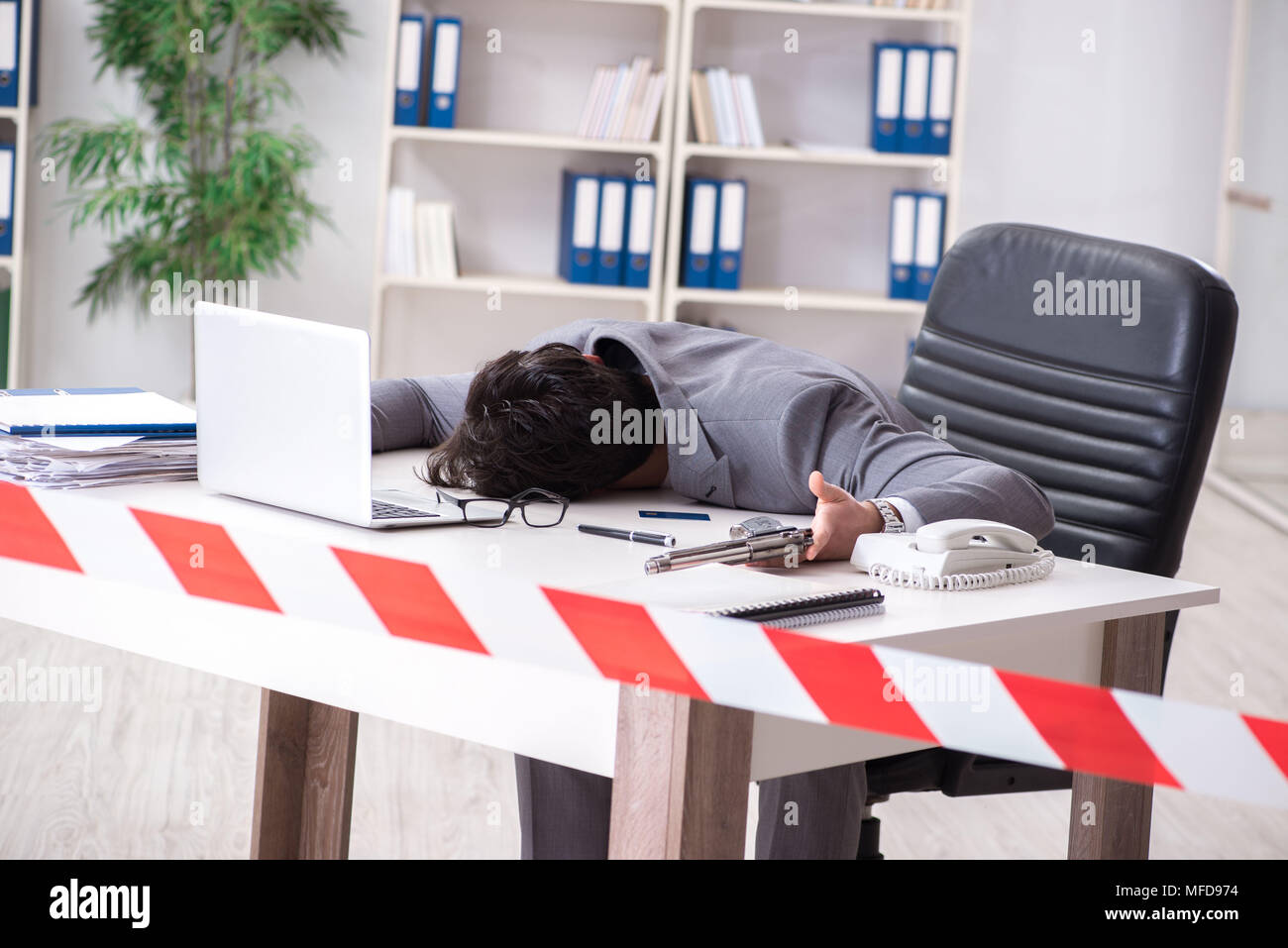 Dead businessman at this desk Stock Photo - Alamy