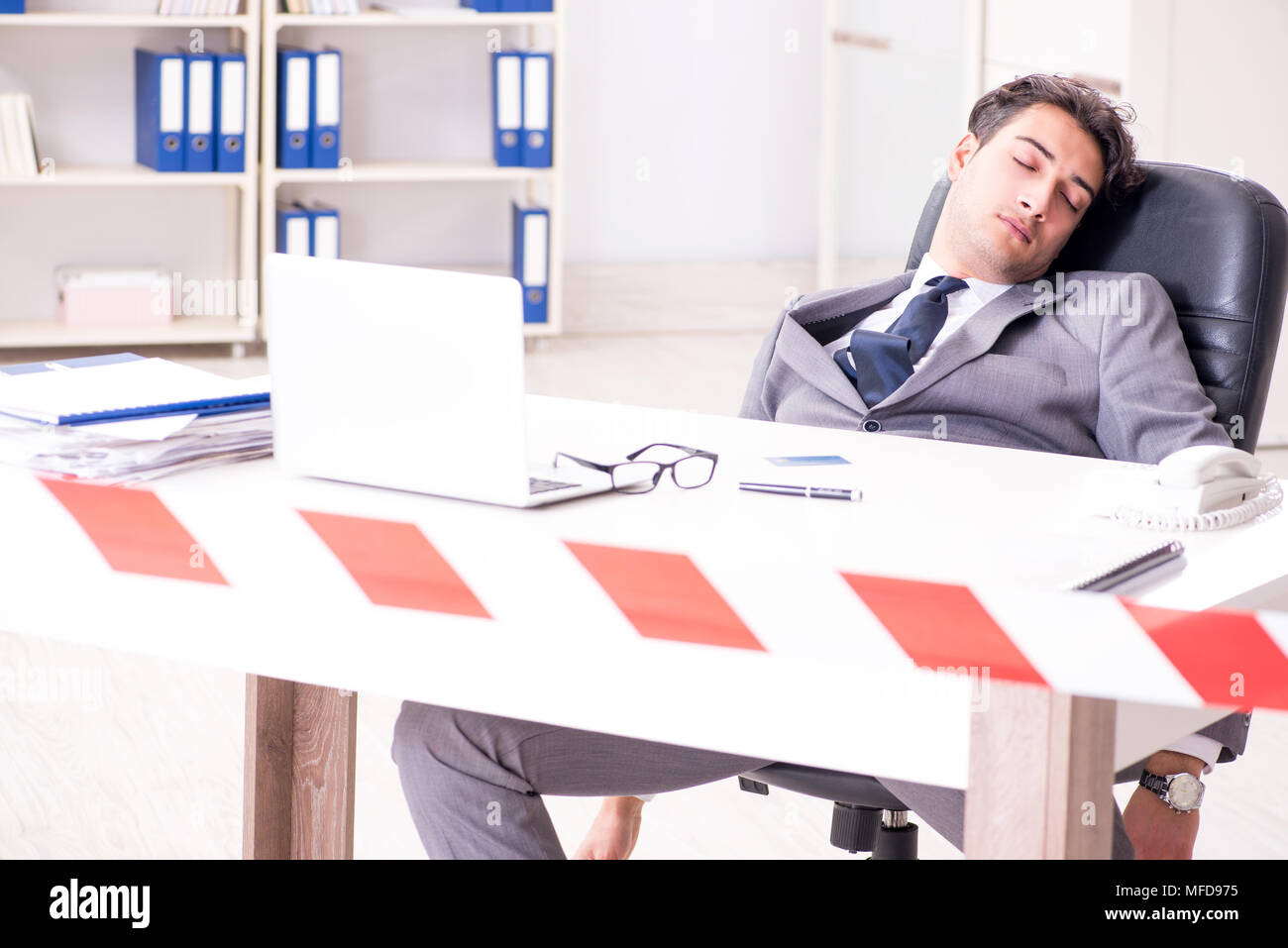 Dead businessman at this desk Stock Photo - Alamy