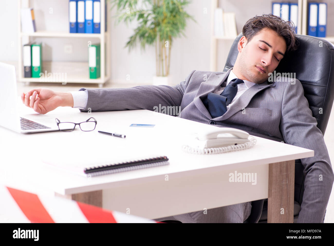 Dead businessman at this desk Stock Photo - Alamy