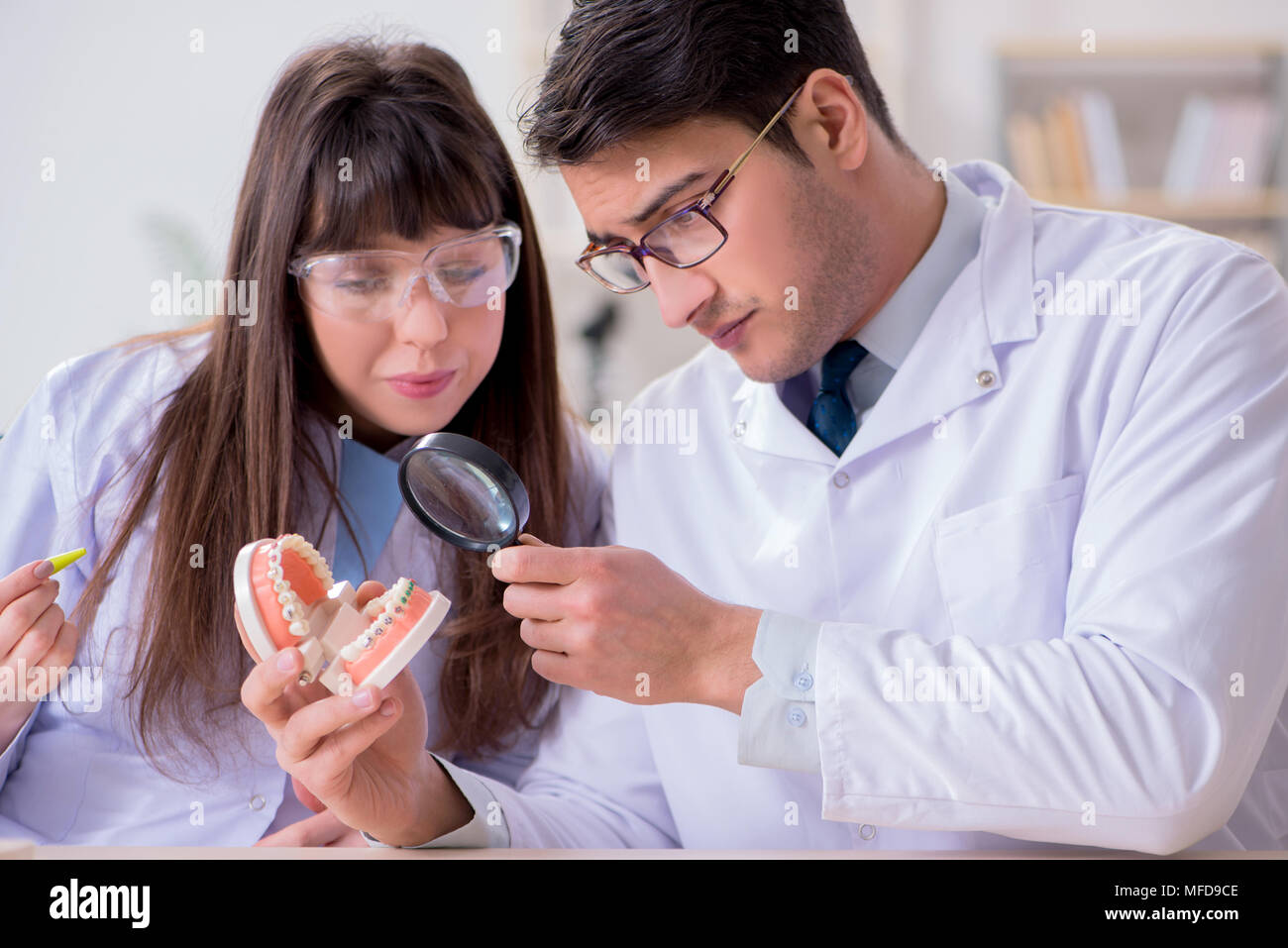 Dentist explaining student tooth structure Stock Photo - Alamy