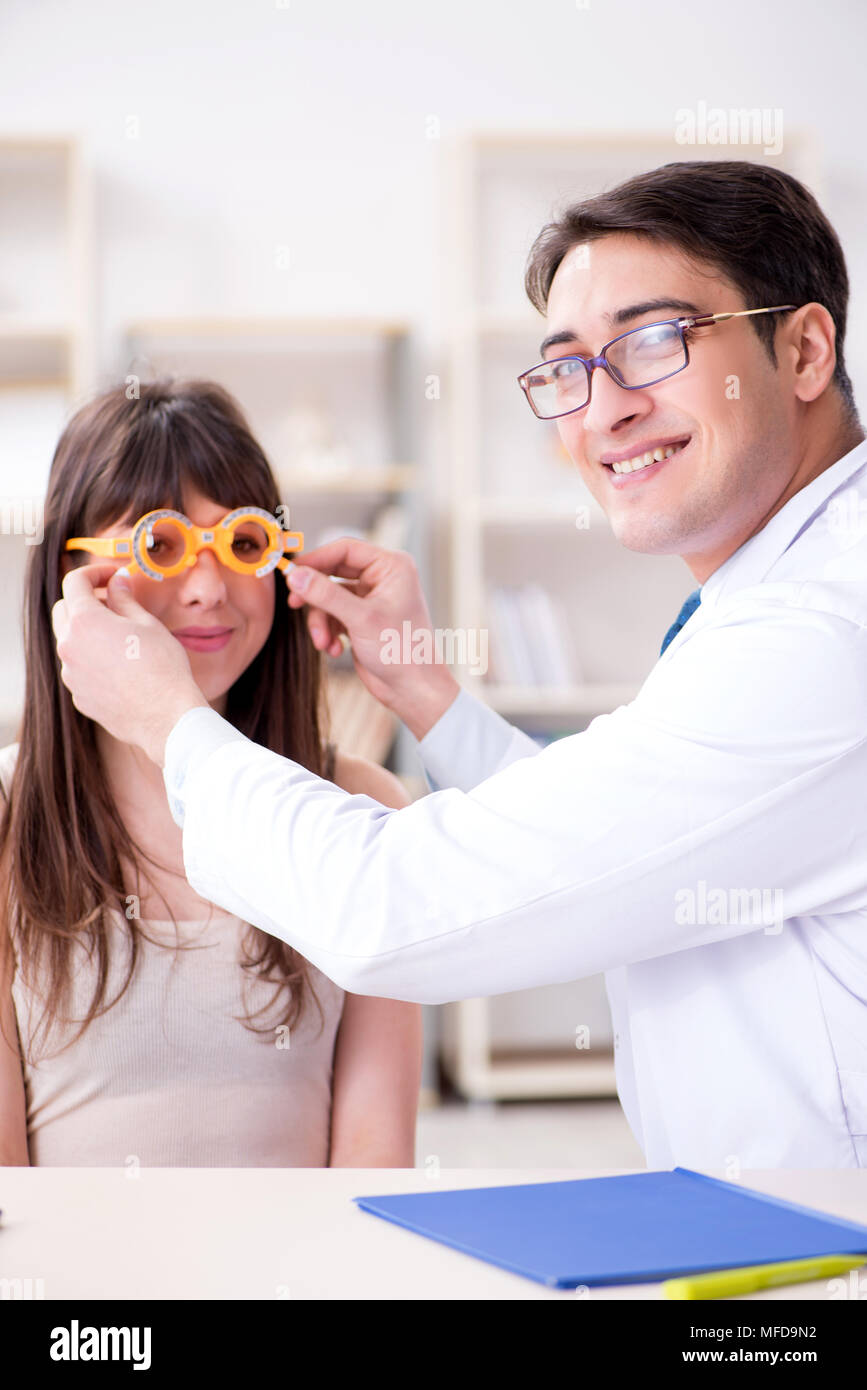 Ophthalmologist is checking up patient in eye doctor hospital Stock ...