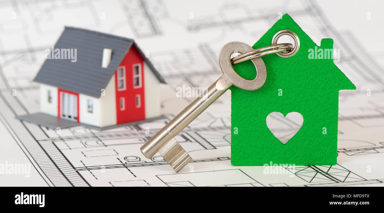model house and home key laying over construction plan Stock Photo - Alamy