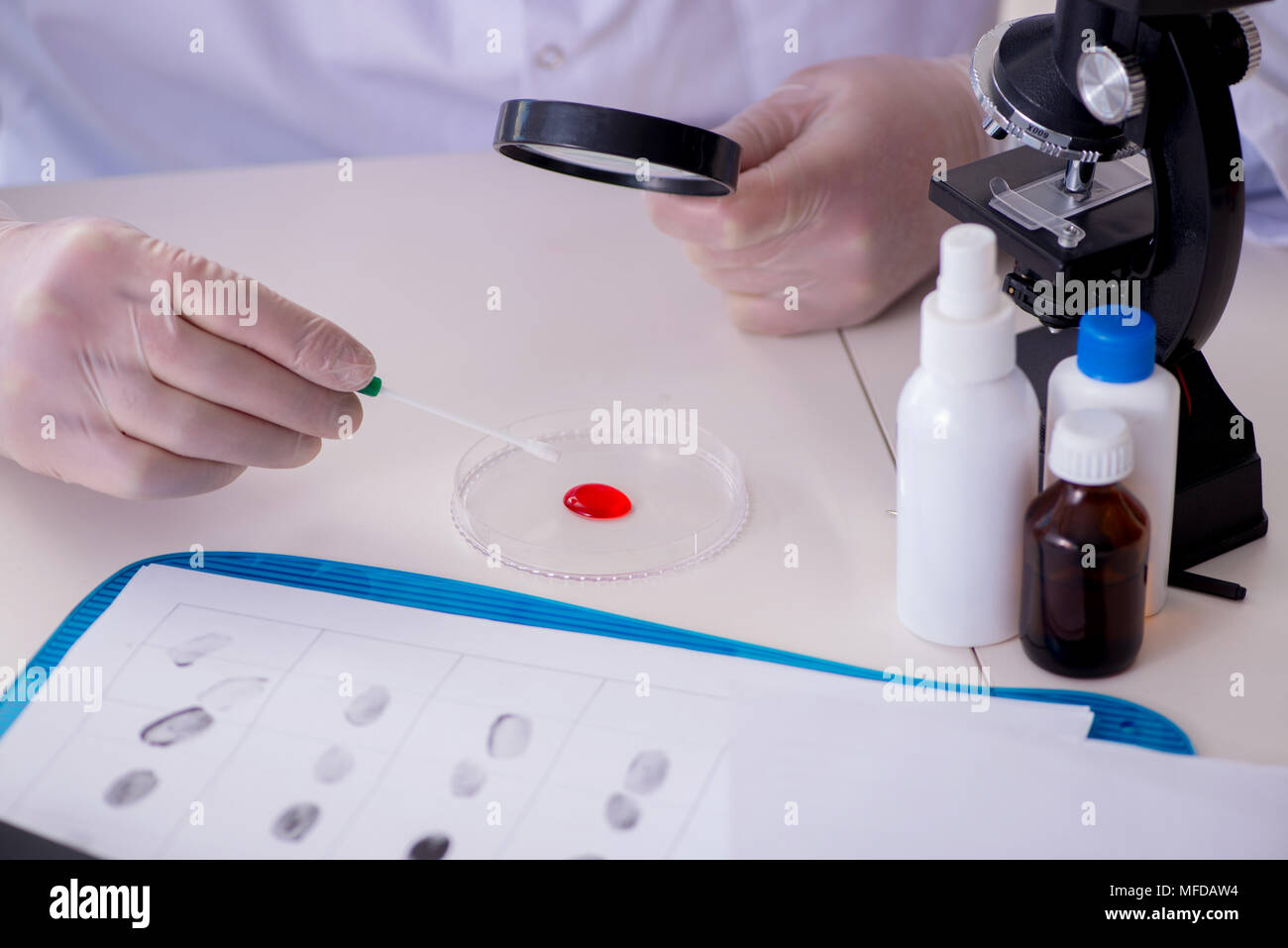 Drug synthesis lab experimentnig with pills Stock Photo - Alamy