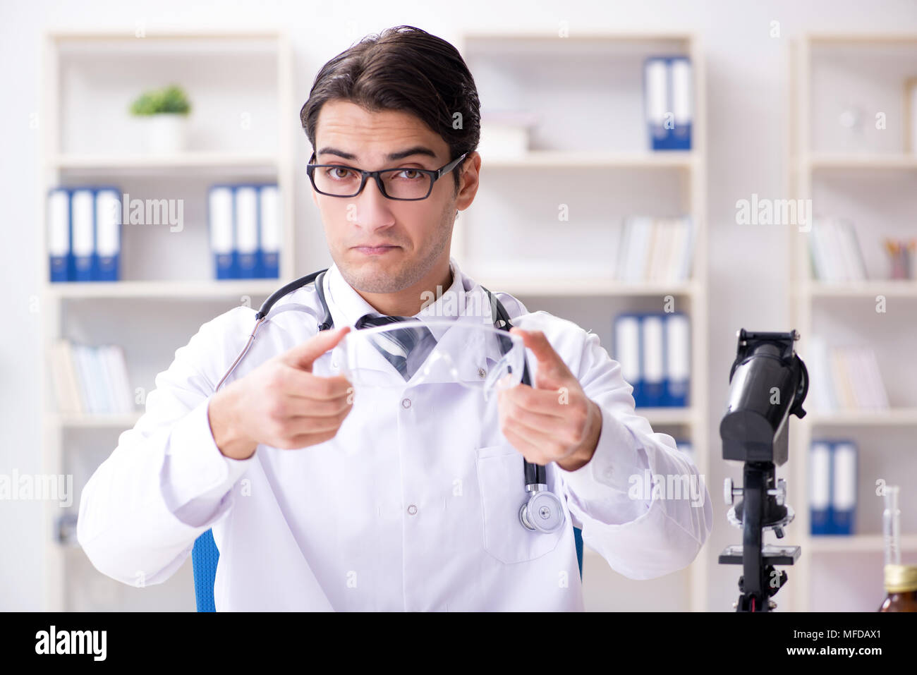 Safety doctor advising about wearing protective goggles Stock Photo - Alamy