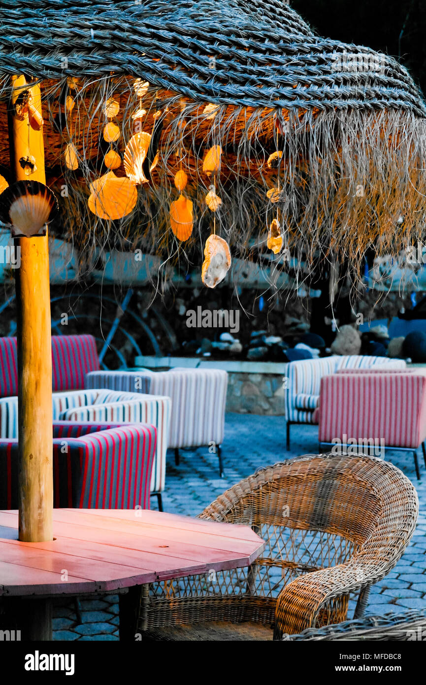 Beach bar cafe tables and seating Stock Photo - Alamy