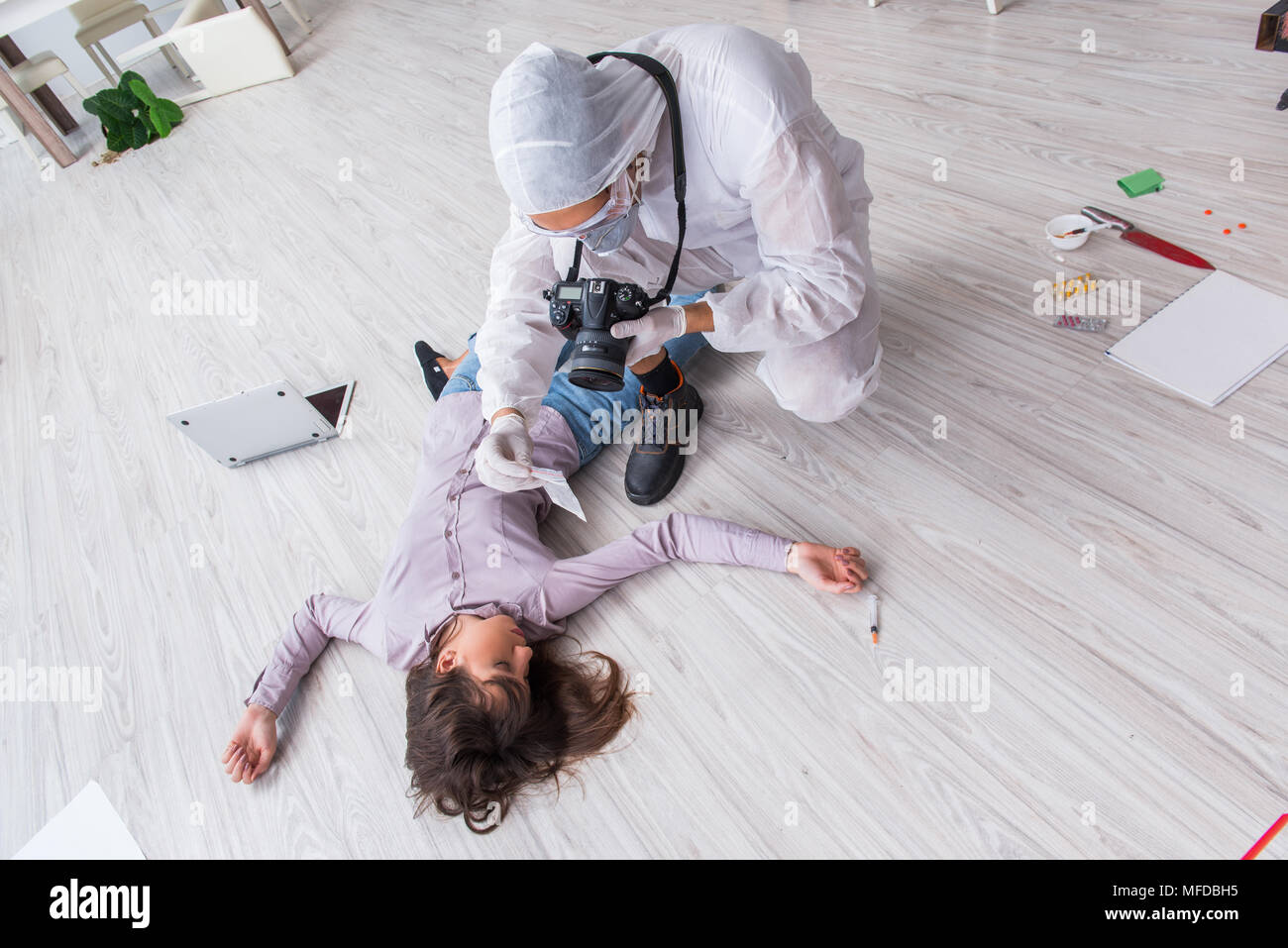 Forensic investigator at the crime scene investigating woman murder ...