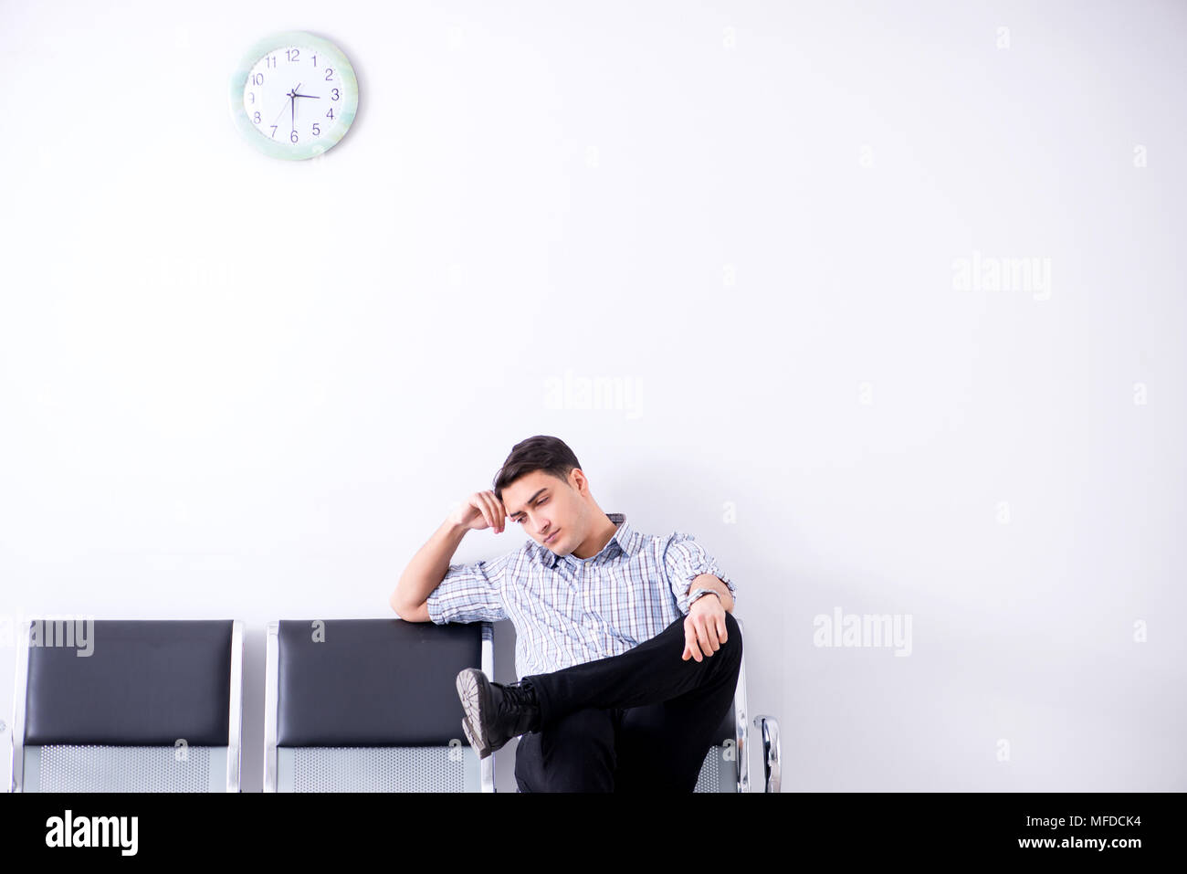 Man nervously impatiently waiting in the lobby Stock Photo - Alamy