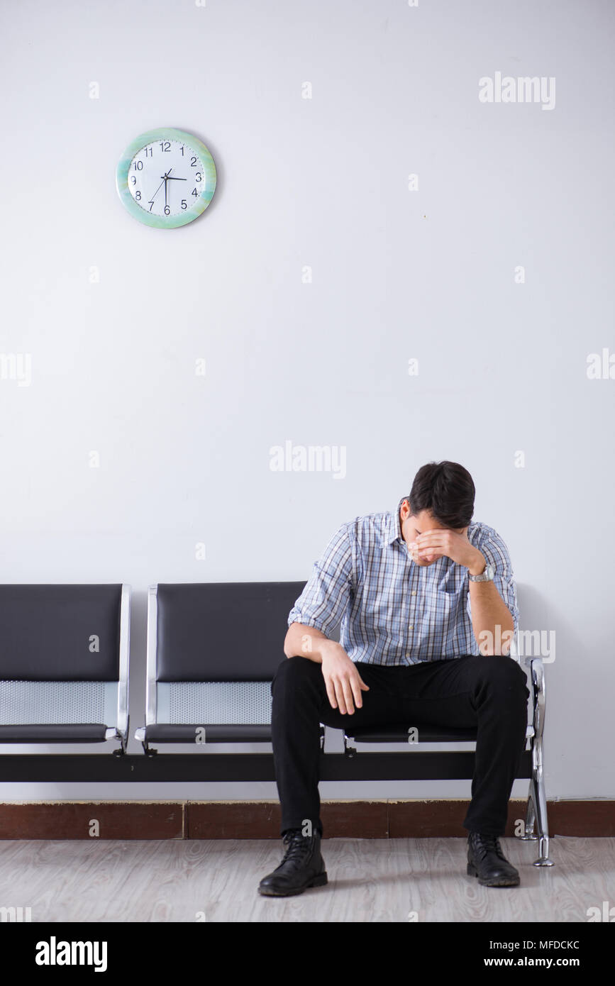 Man nervously impatiently waiting in the lobby Stock Photo - Alamy