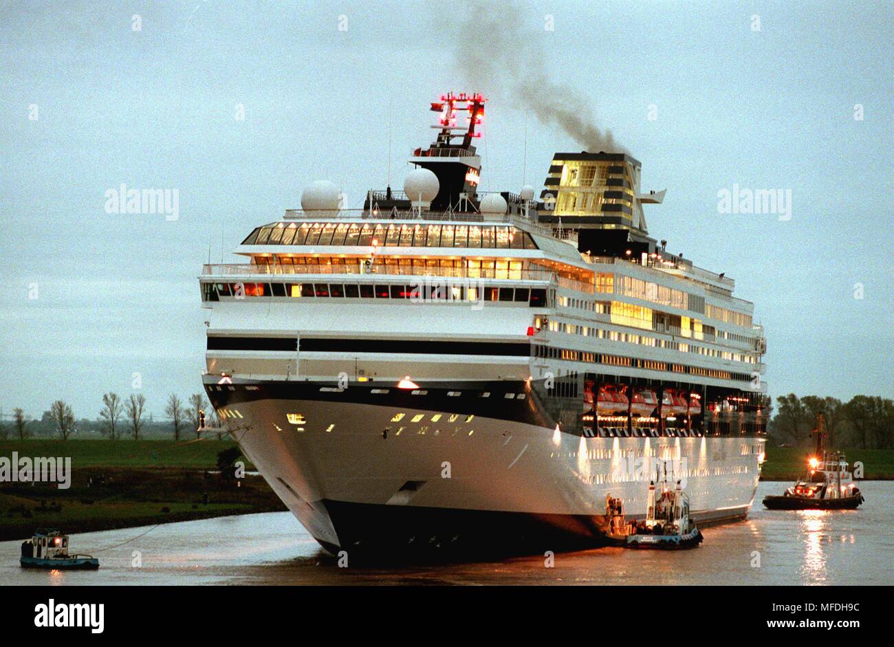 The 249 m long and 32 m wide cruise ship "Century" is, held by a tug ...