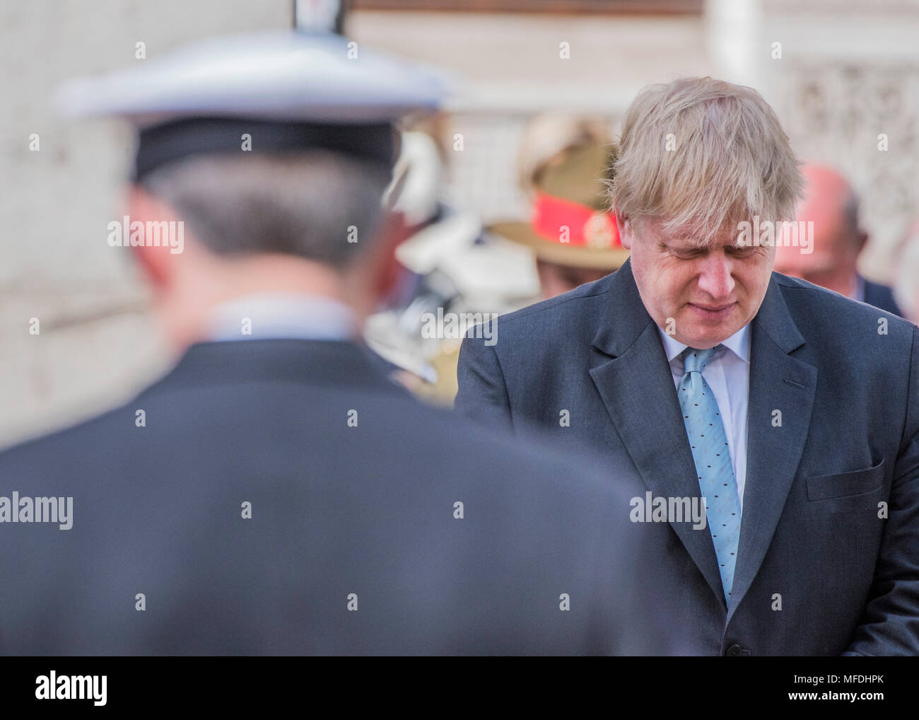 London, UK. 25th April 2018. Boris Johnson bows his head in reflection ...