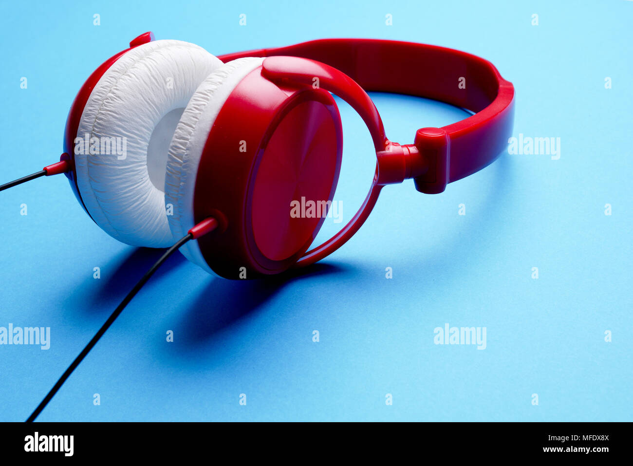 Photo of red with white headphones close-up Stock Photo - Alamy