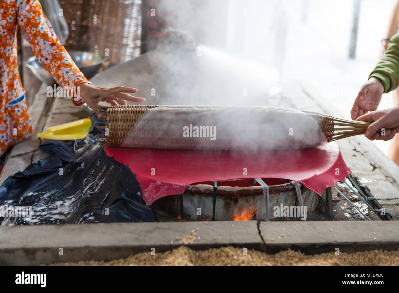 Traditional way of making rice paper and noodles Stock Photo - Alamy