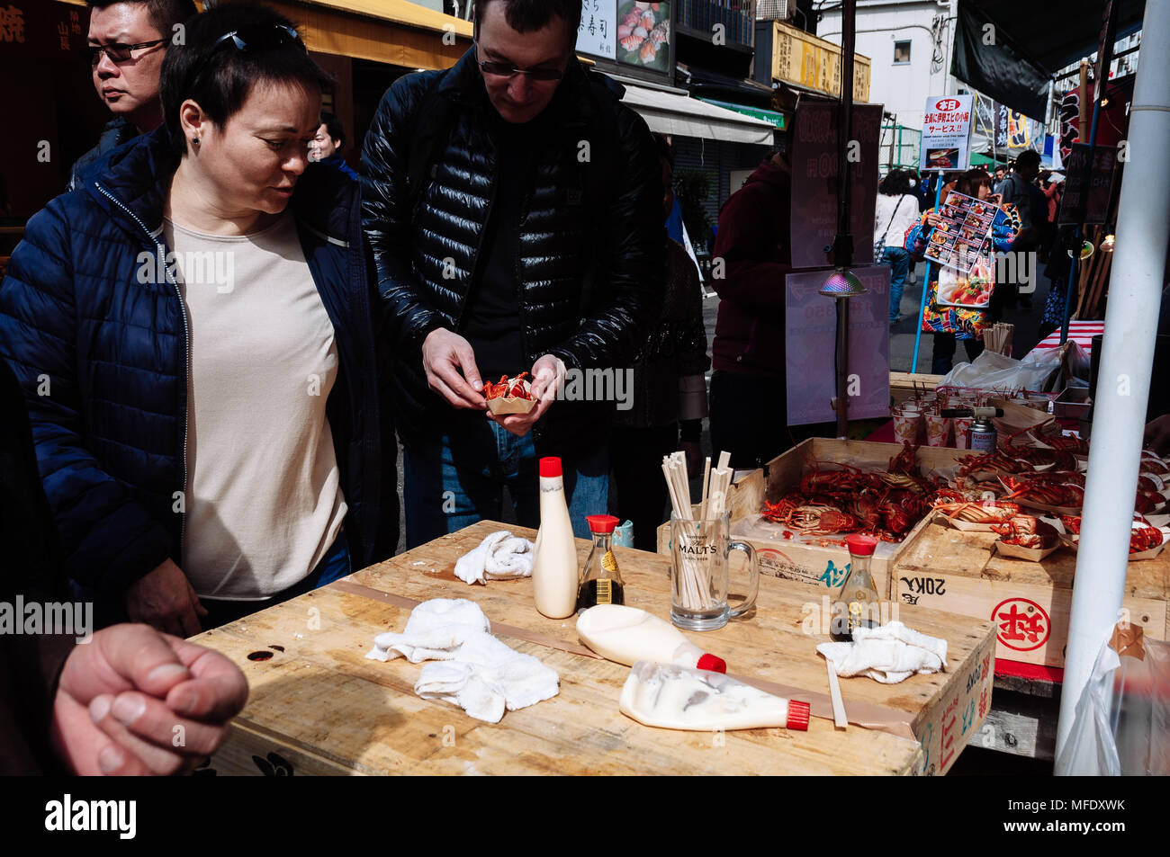 People in Tsukiji fish market food stalls area Stock Photo - Alamy