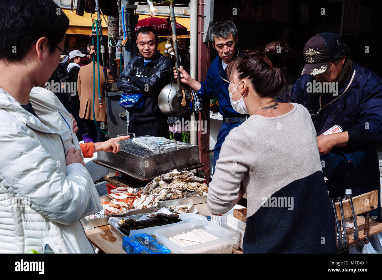 People in Tsukiji fish market food stalls area Stock Photo - Alamy