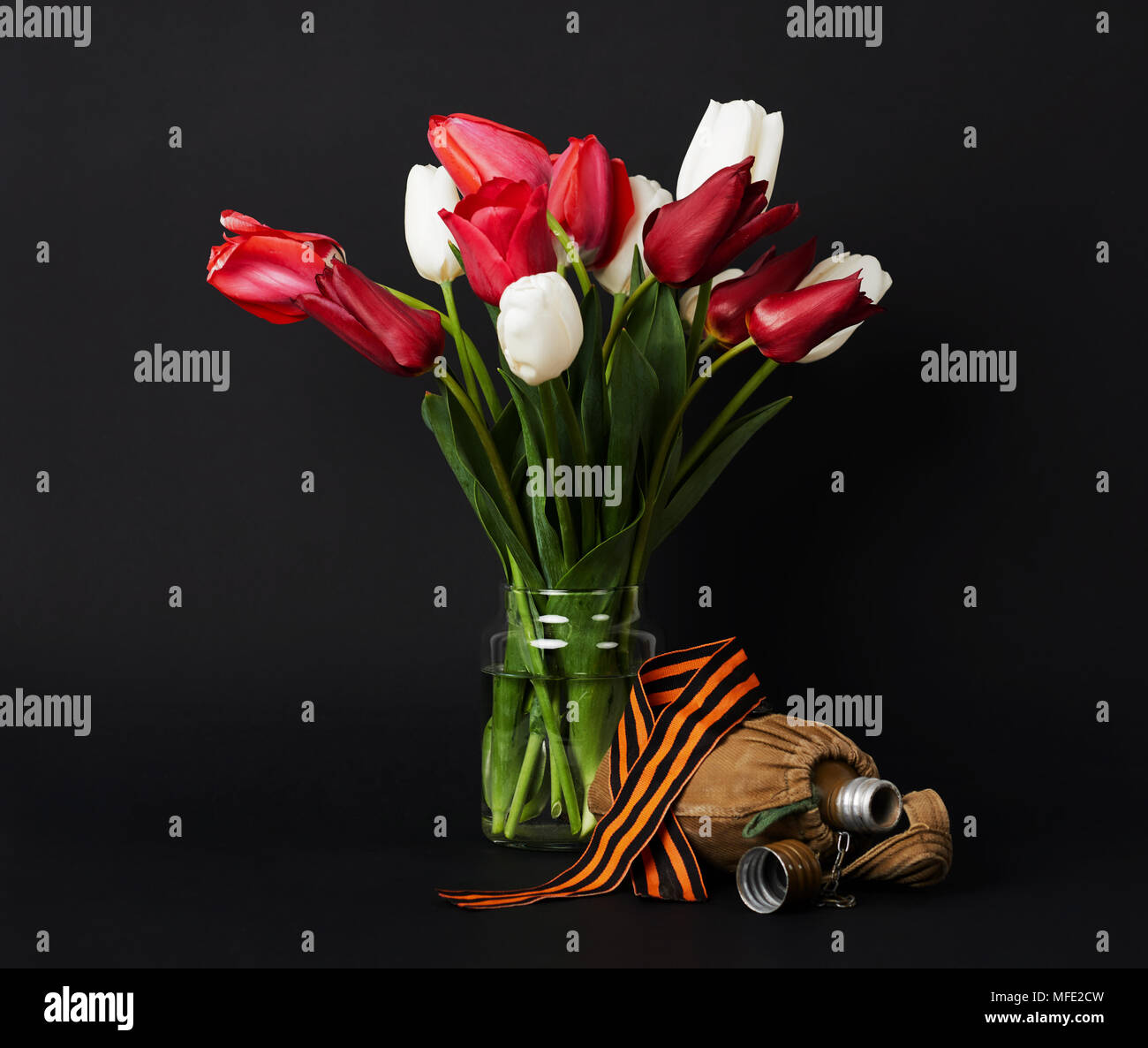 old soldier's flask and St. George's ribbon on black background, world ...