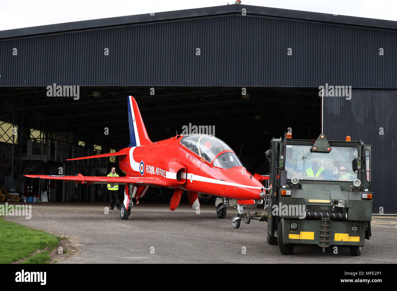 The Red Arrows Hawk is maneuvered into a hanger next to Concorde where ...