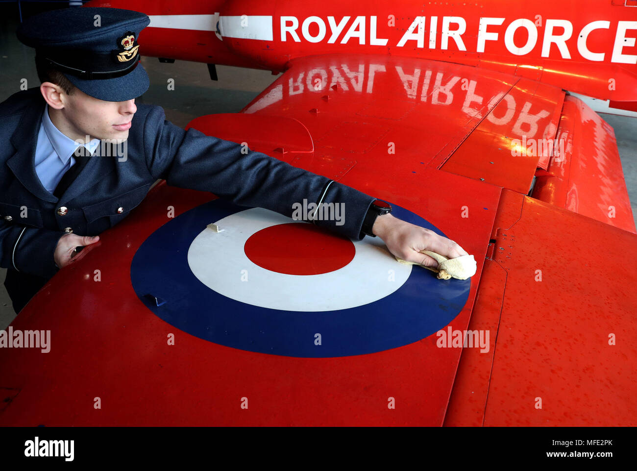 Flying officer Scott Bagshaw wipes the wing of the Red Arrows Hawk ...