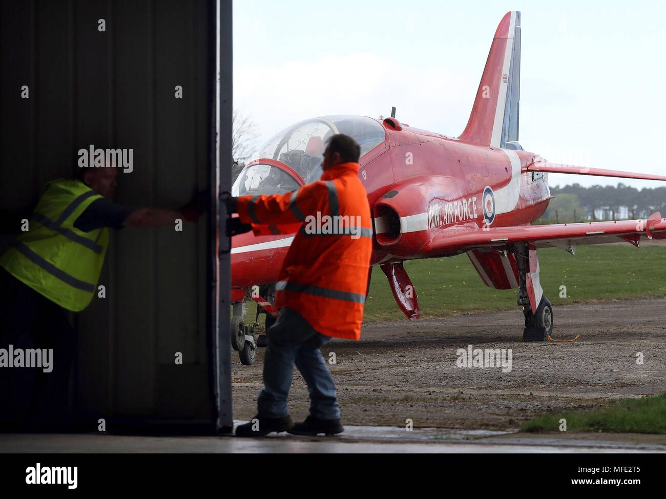 The Red Arrows Hawk is maneuvered into a hanger next to Concorde where ...