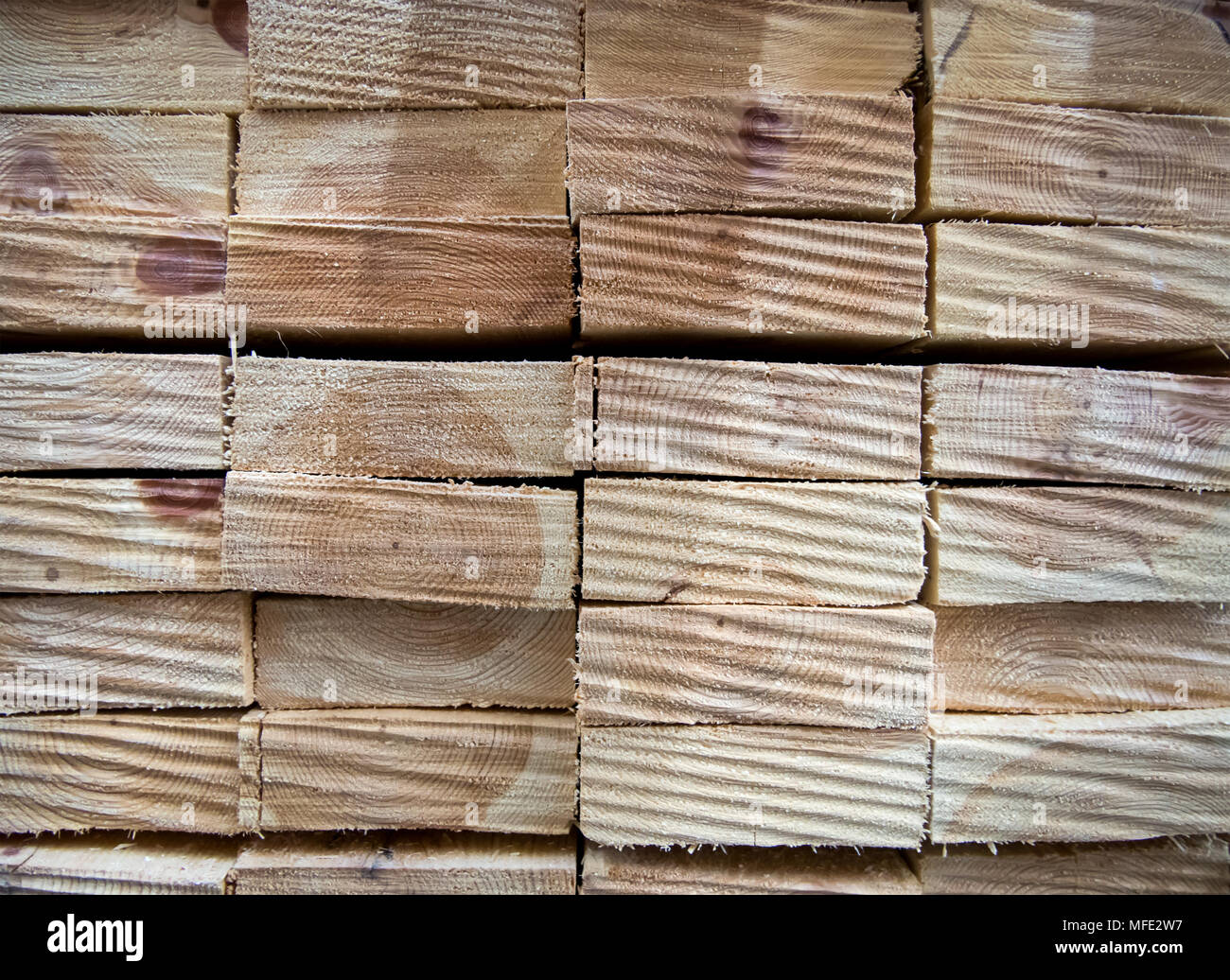 Wooden thick boards assembled together in a pile Stock Photo - Alamy