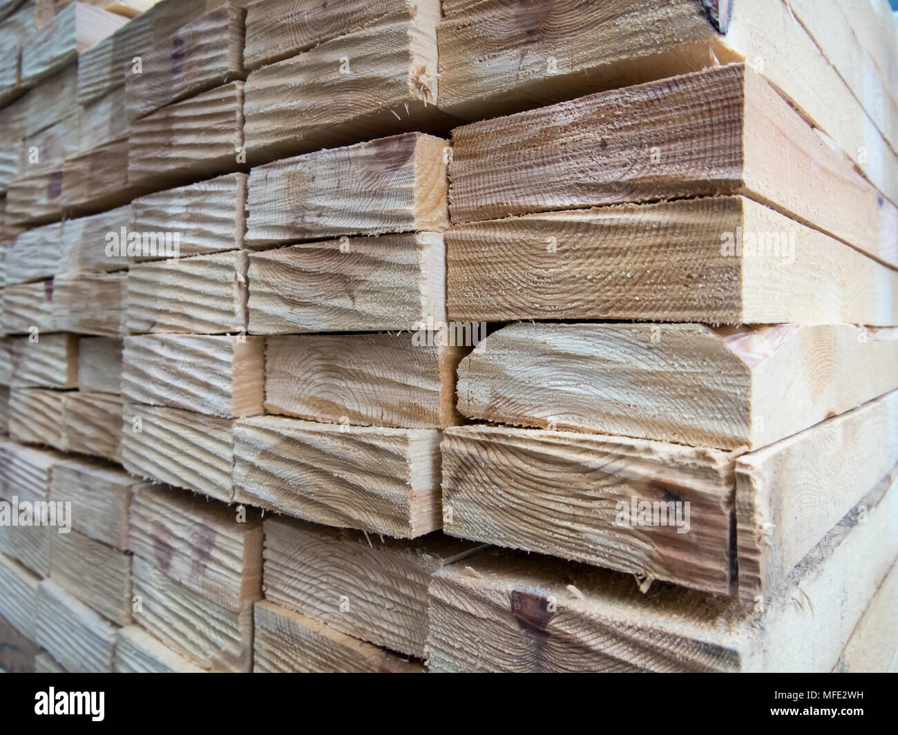 Wooden planks stacked together in a stack Stock Photo - Alamy