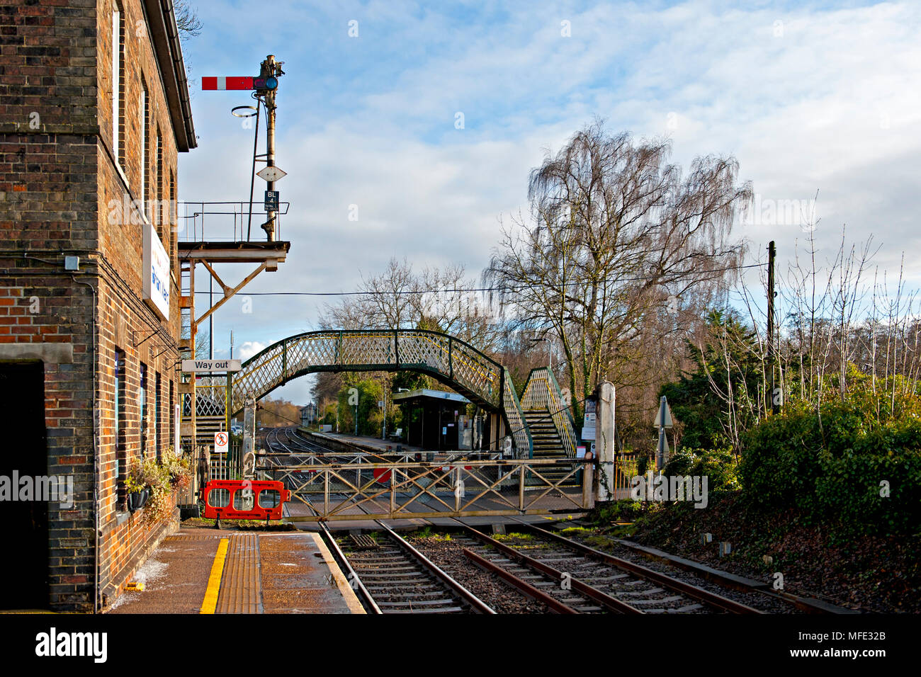 Manually operated crossing gates at Brundall Railway Station, on the ...