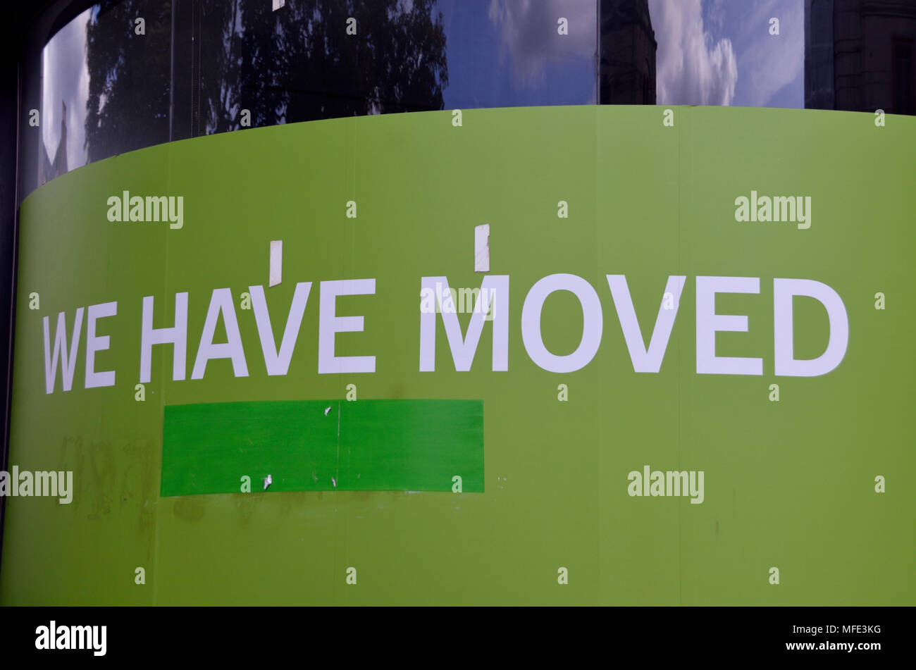 We Have Moved sign on a window Stock Photo - Alamy
