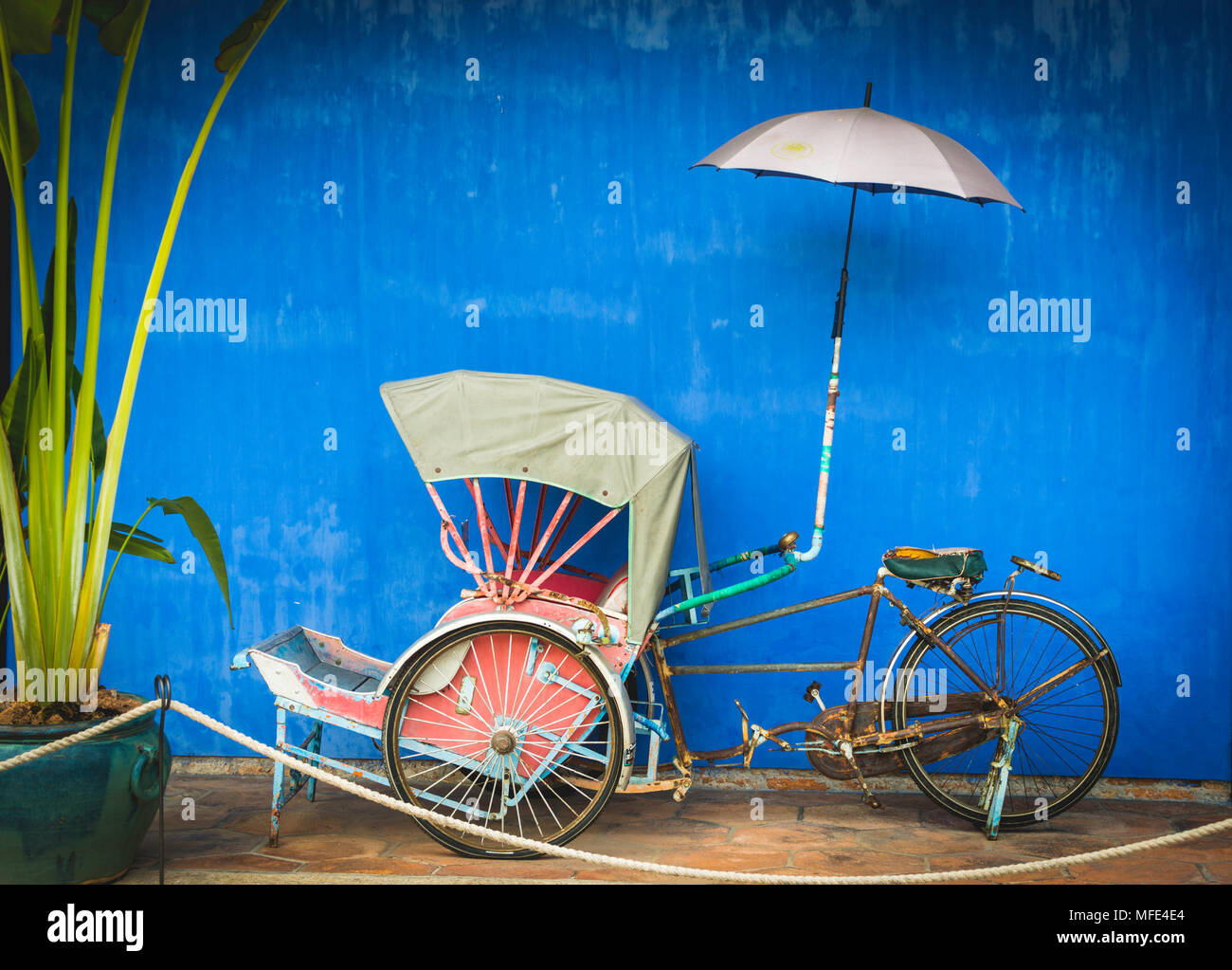 Old bicycle rickshaw, rickshaw on the blue wall, Cheong Fatt Tze ...