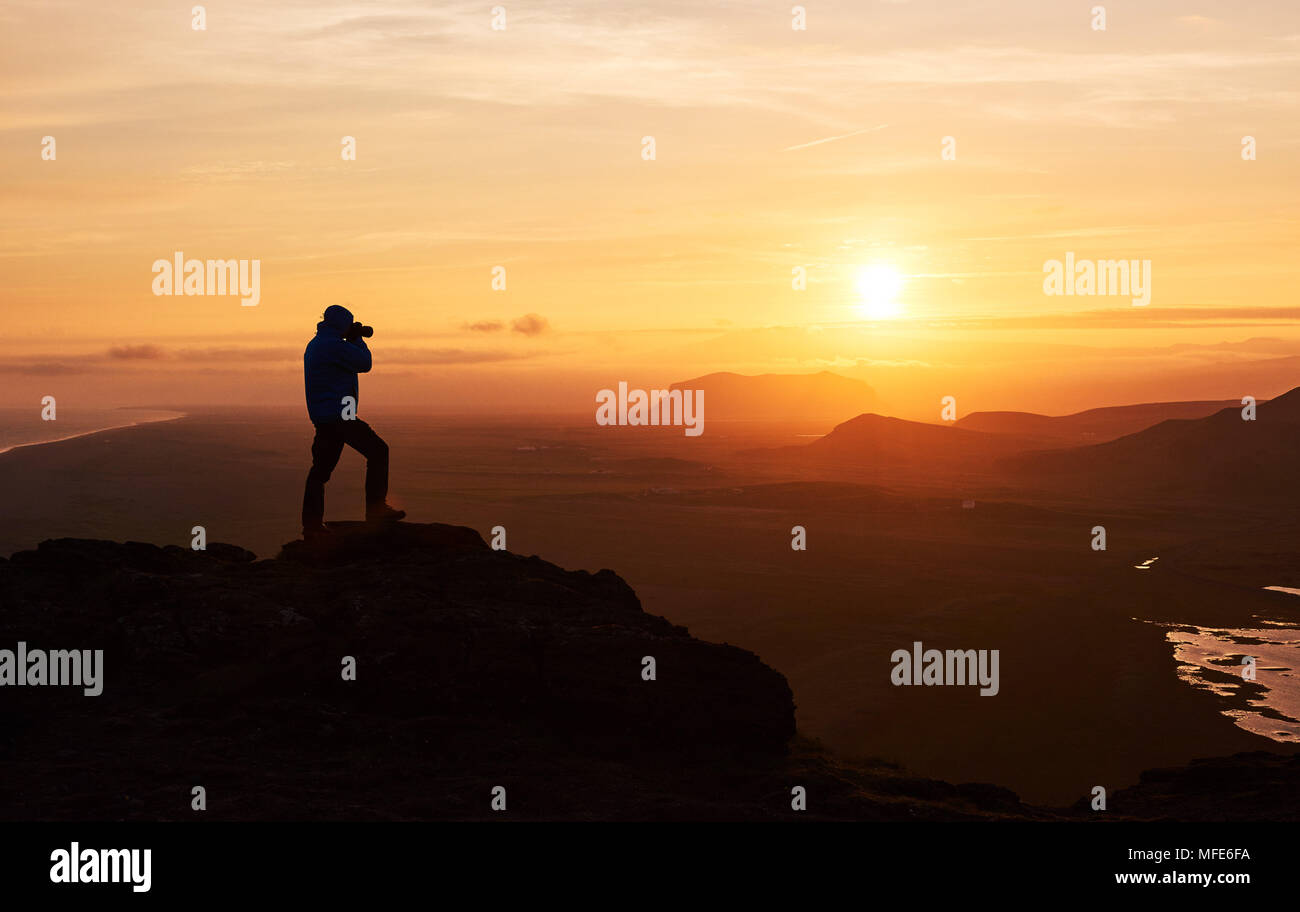 Nature photographer with digital camera on top of the mountain Stock ...