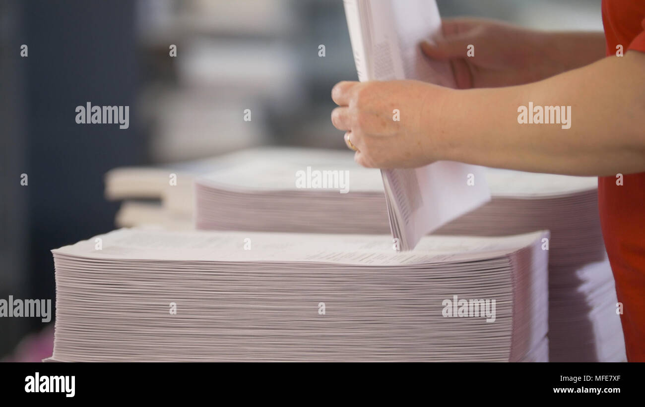 Hands of female workers shift the paper stacks Stock Photo - Alamy