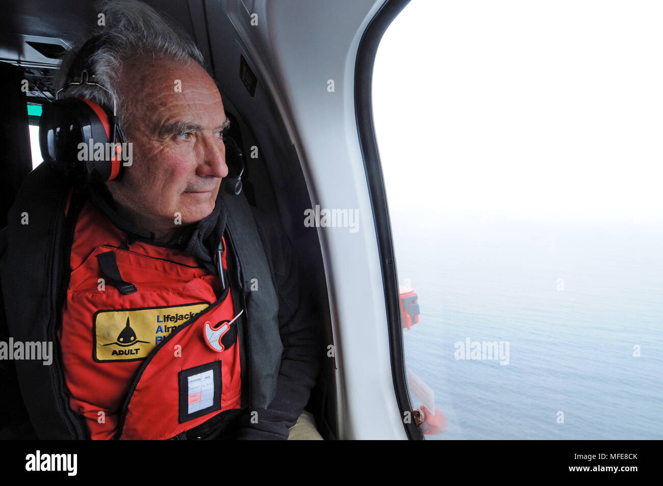 Roy Dennis ornithologist flying into Fair isle by helicopter officially ...