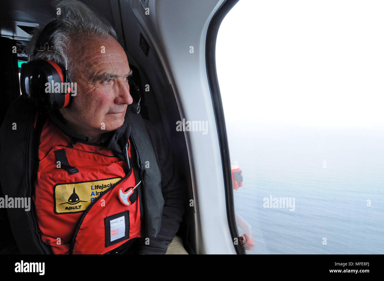 Roy Dennis ornithologist flying into Fair isle by helicopter officially ...