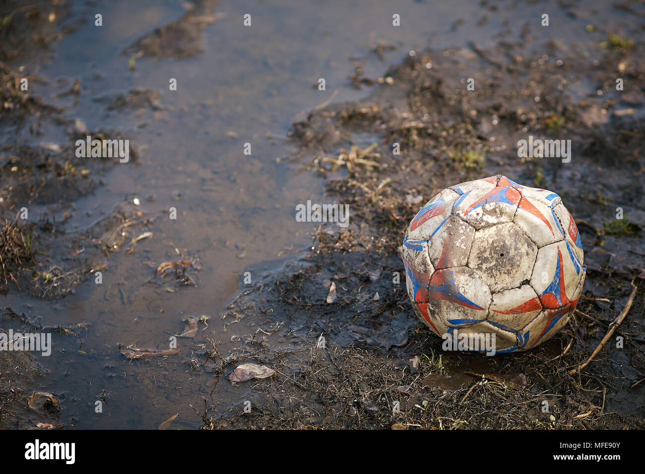 The closeup image of an old ball on the ground Stock Photo - Alamy