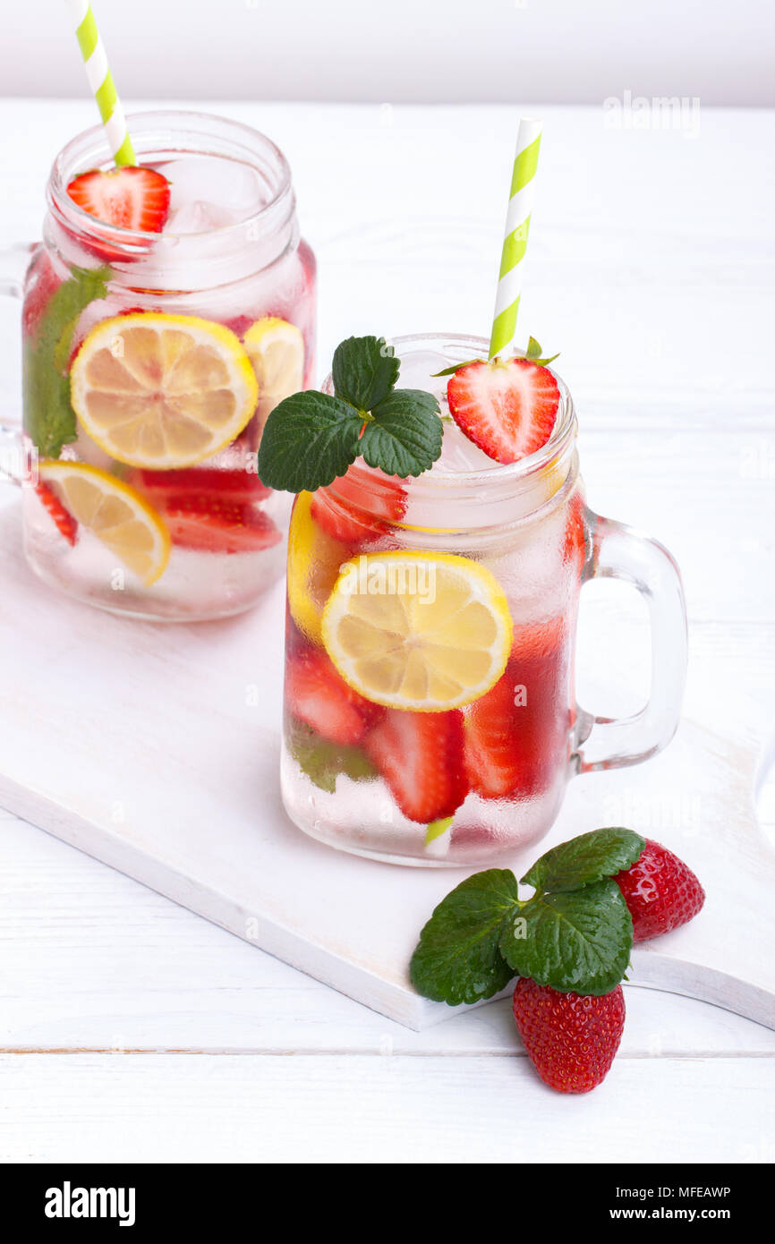 Detox fruit infused flavored water. Refreshing summer homemade cocktail ...