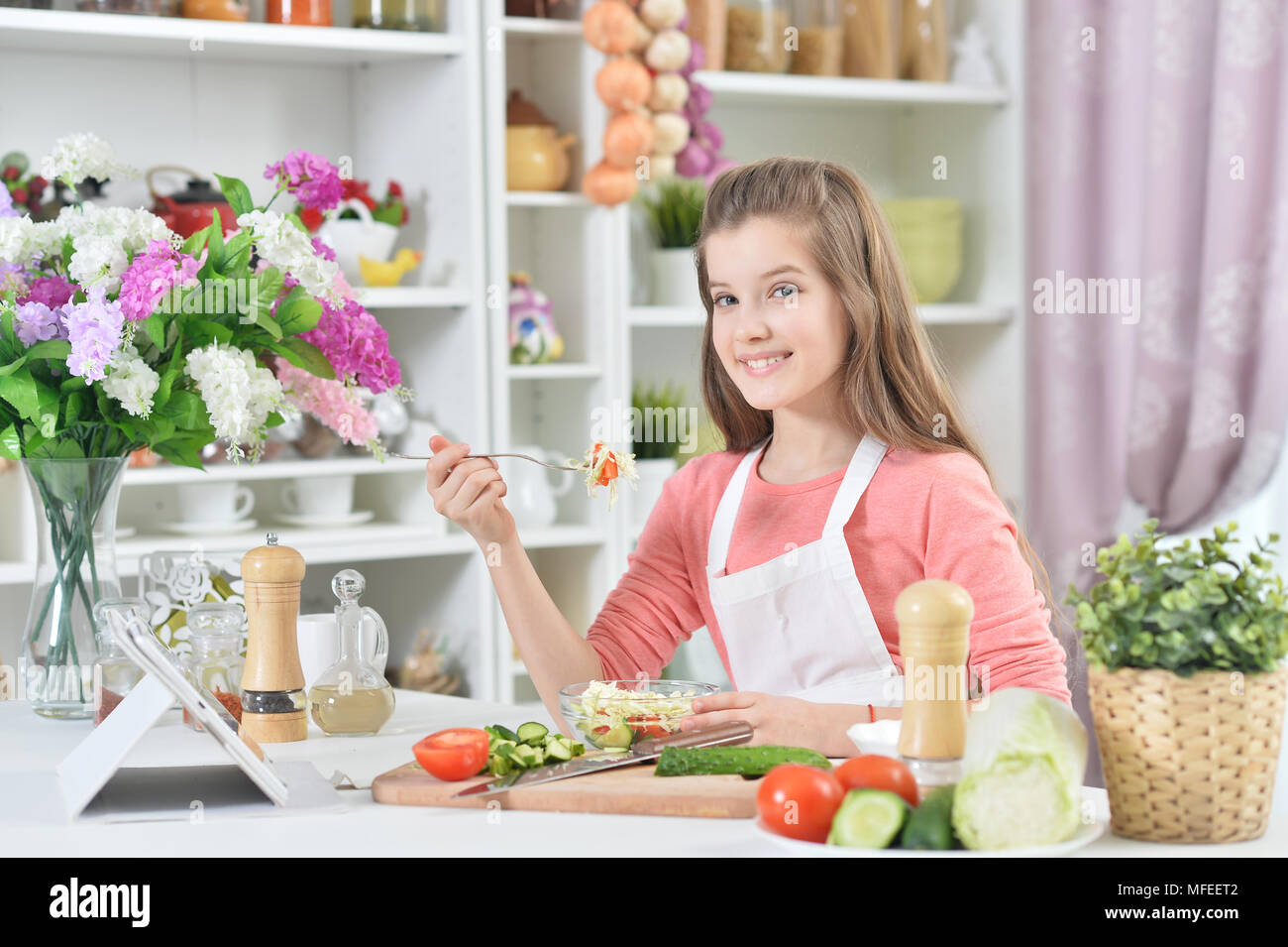attractive young girl cooking Stock Photo - Alamy