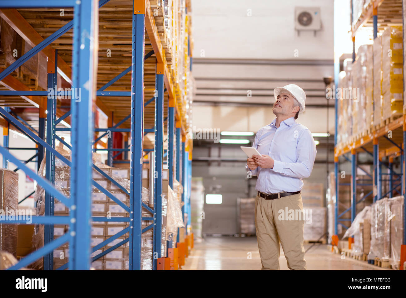 Nice serious man looking up Stock Photo - Alamy