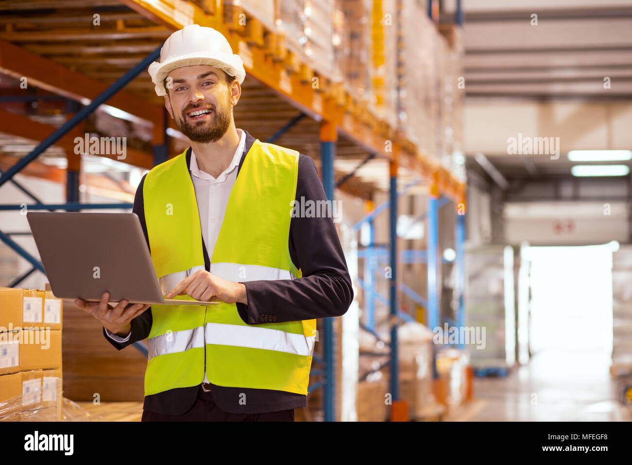 Cheerful delivery manager controlling work Stock Photo - Alamy