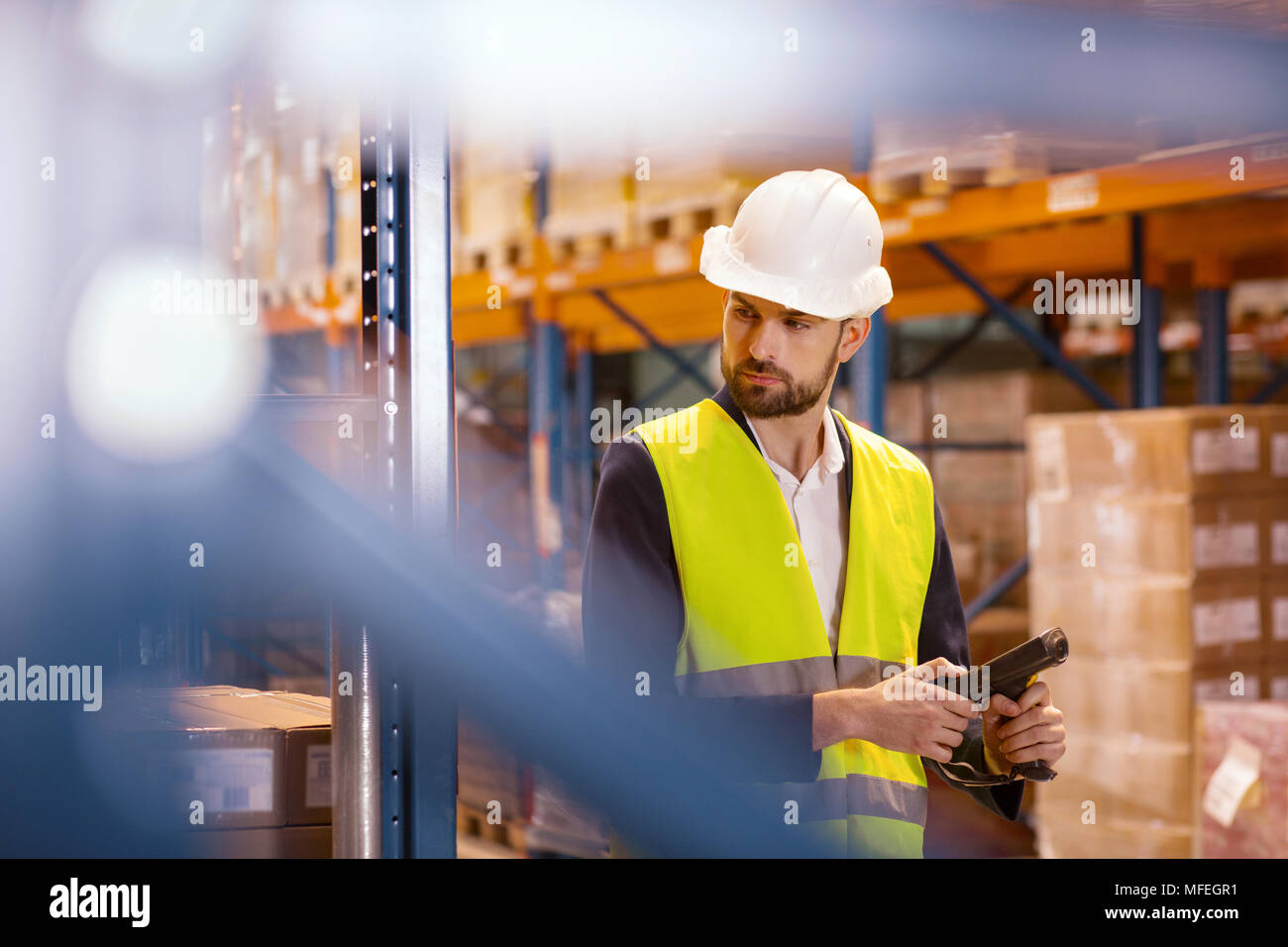Delivery man scanning boxes hi-res stock photography and images - Alamy
