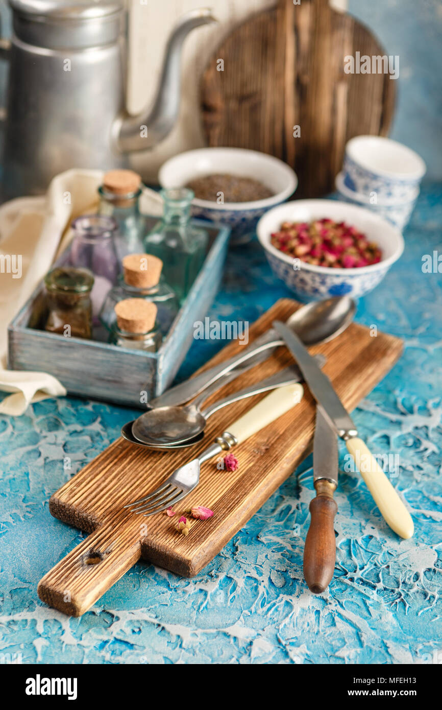 Various kitchen utensils cutlery on blue background Stock Photo - Alamy