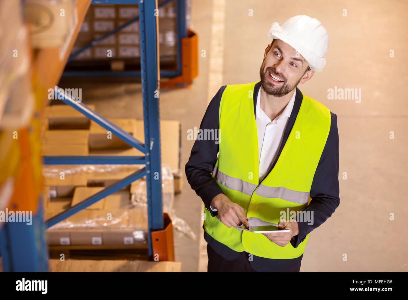 Smart logistics manager doing his work Stock Photo - Alamy