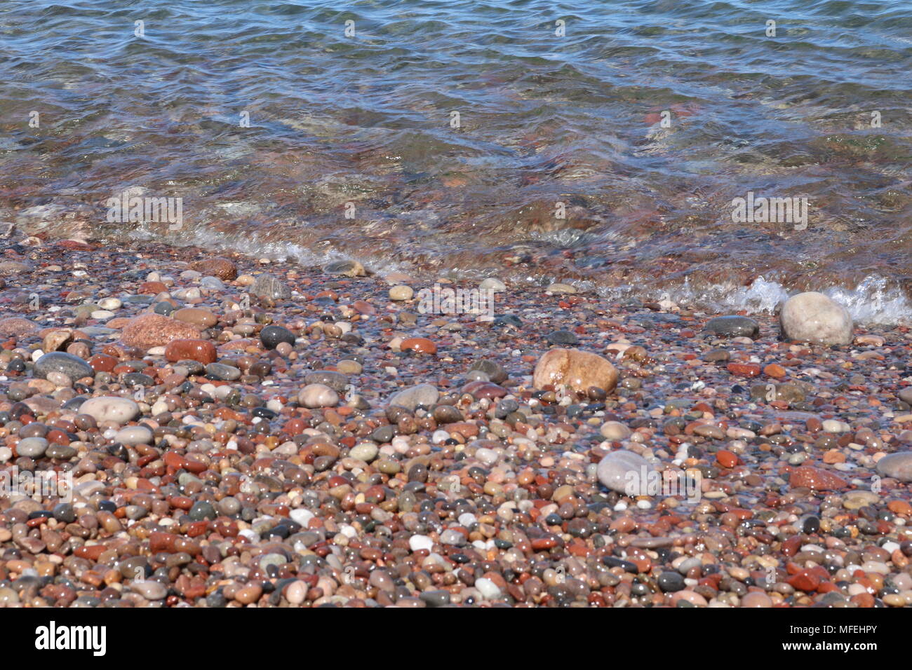 Pebbles on pebble beach Stock Photo - Alamy