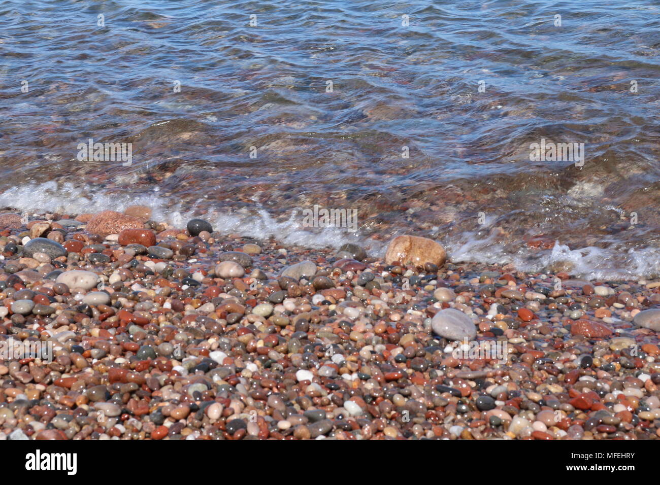 Pebbles on pebble beach Stock Photo - Alamy