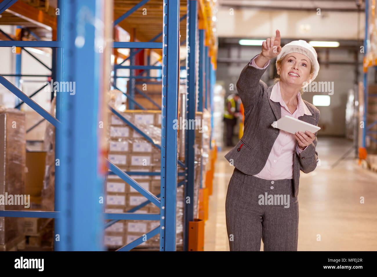 Joyful nice woman pointing the direction Stock Photo - Alamy