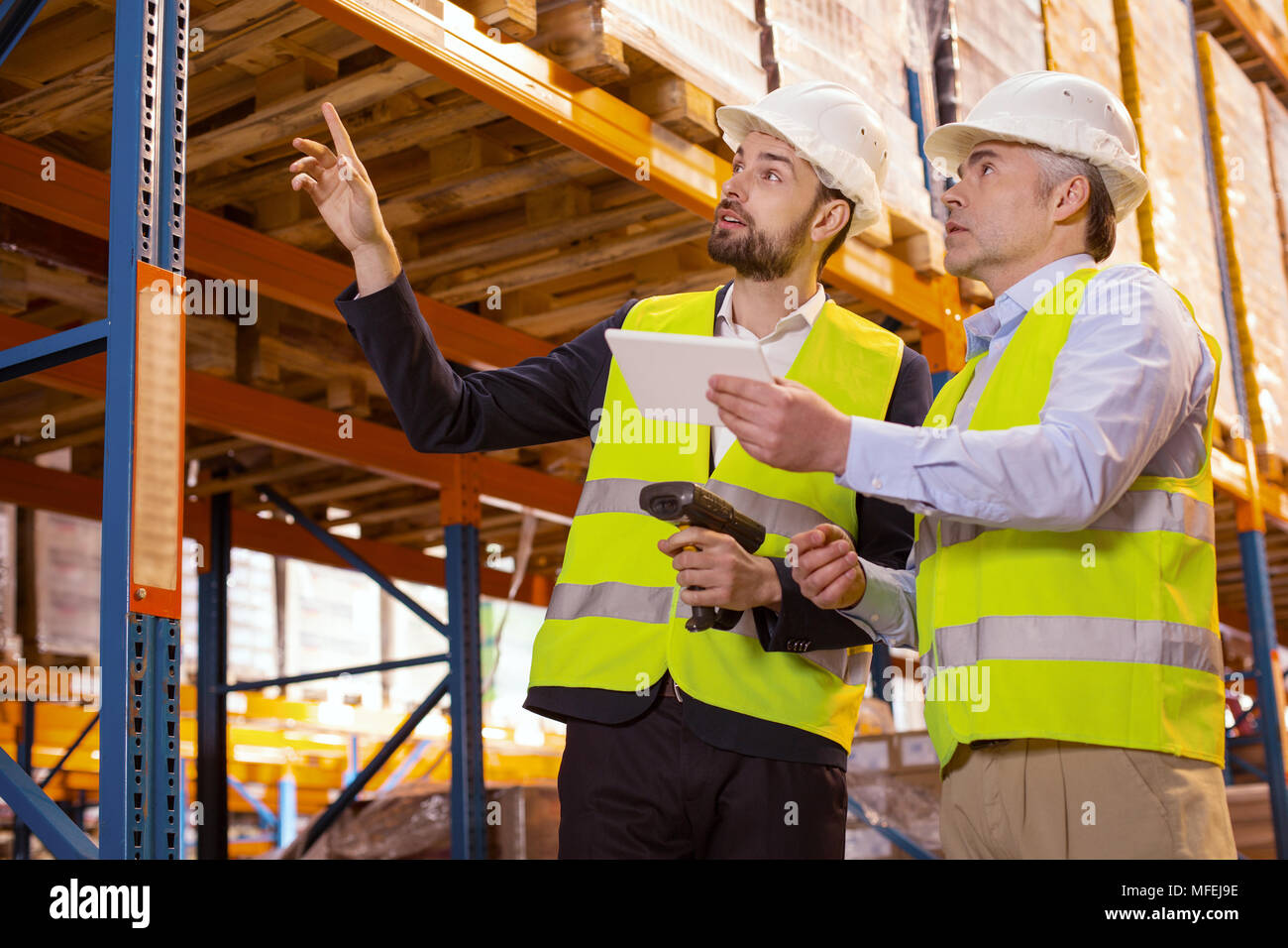 Pleasant young man talking to his boss Stock Photo - Alamy