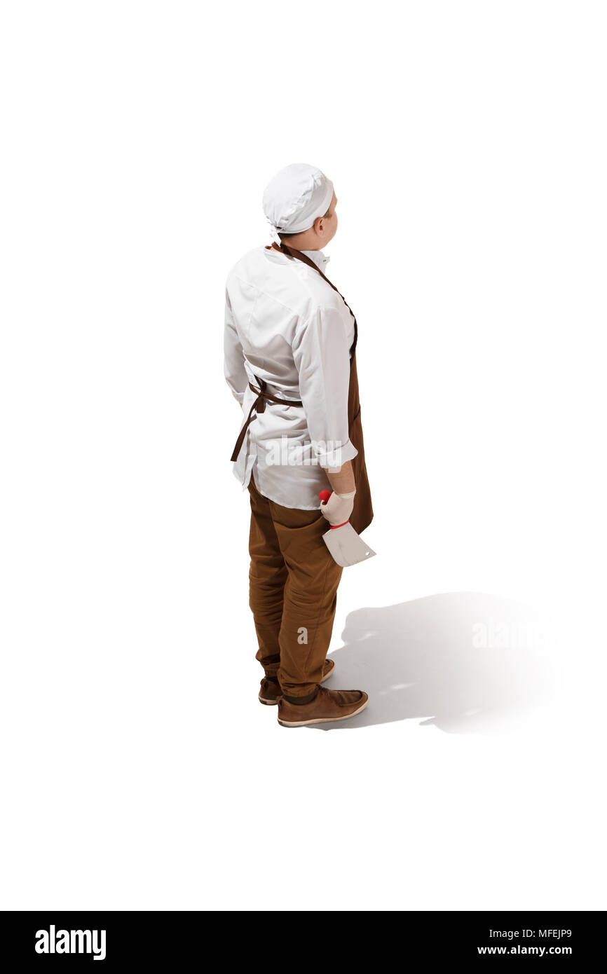 The back of serious butcher posing with a cleaver isolated on white ...