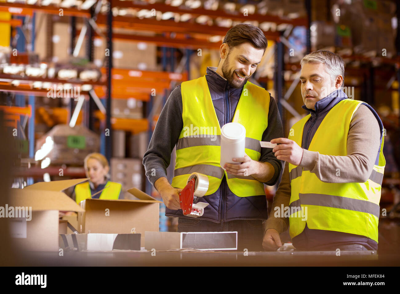Serious nice man looking at the label Stock Photo - Alamy