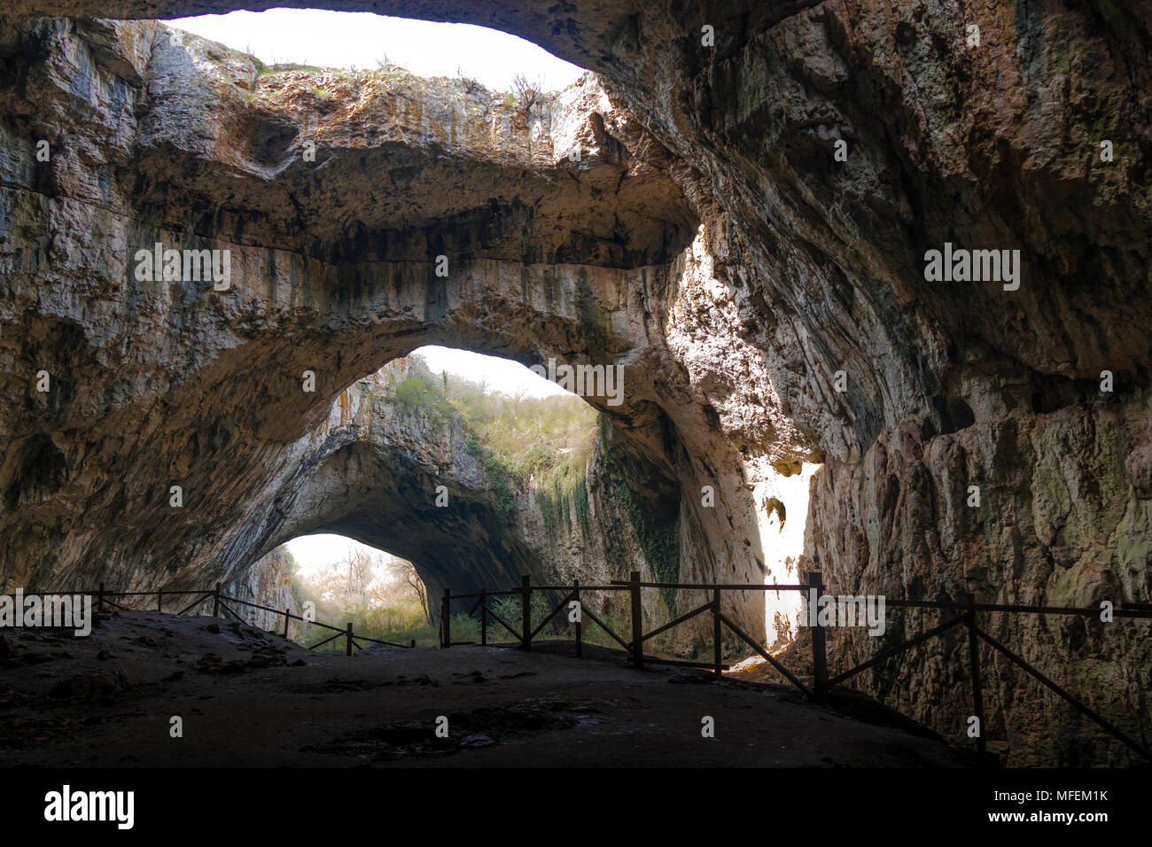 big cave with top openings Stock Photo - Alamy