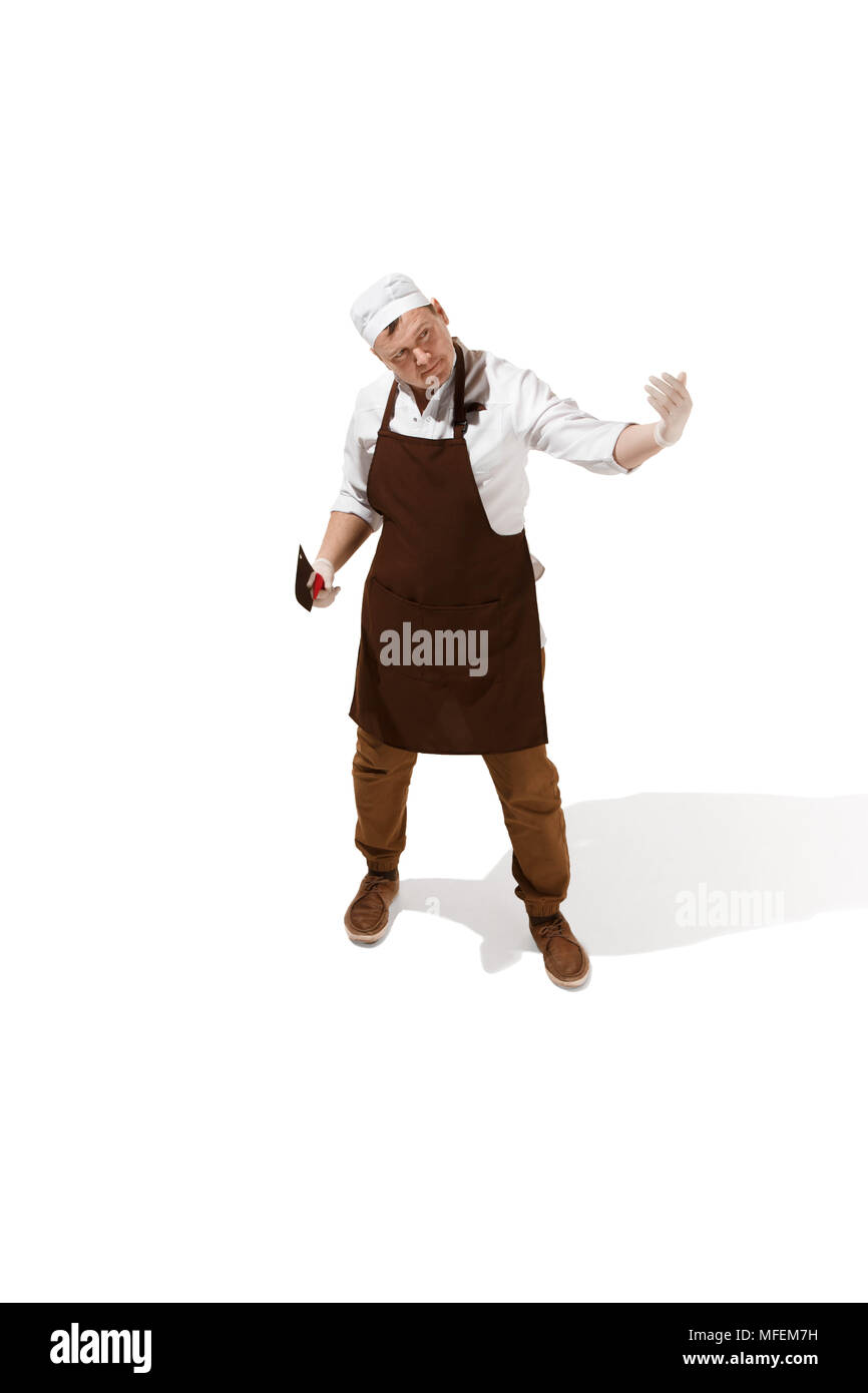 Angry aggressive butcher posing with a cleaver isolated on white ...