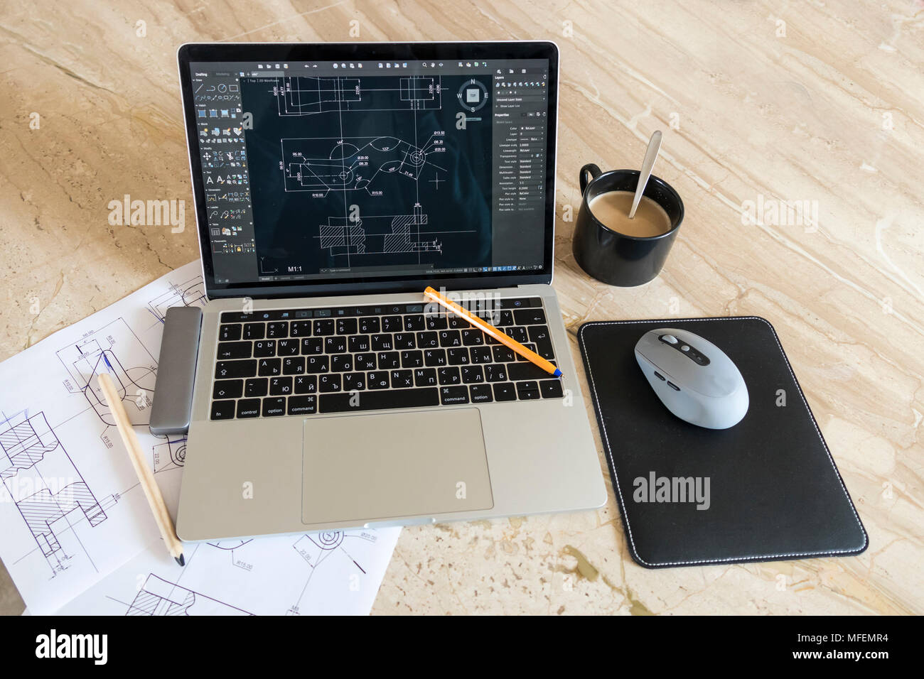 laptop with blueprints mechanical work desk Stock Photo - Alamy